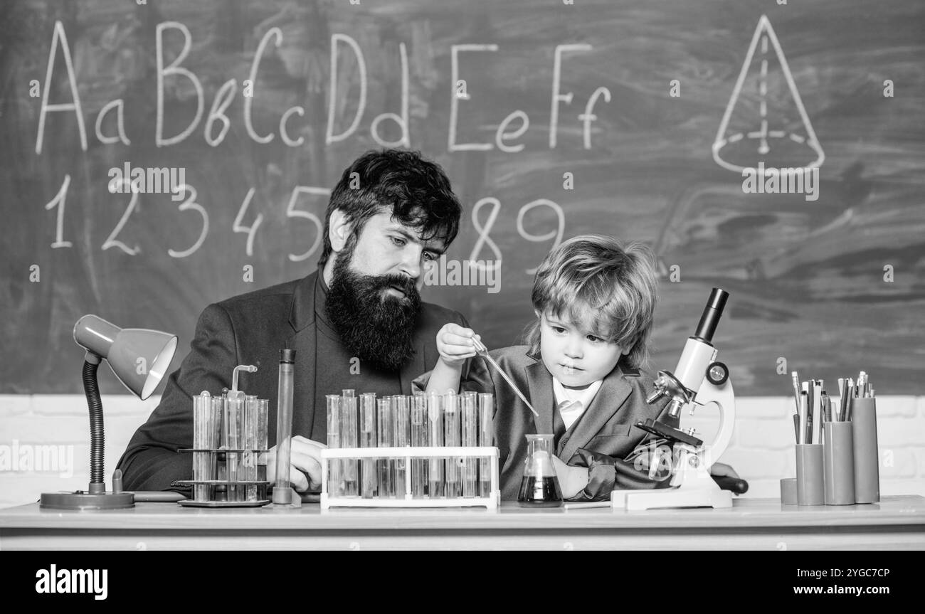 laboratory research and development. father and son child at school ...
