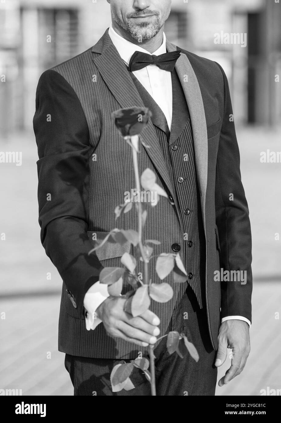 proposal concept. cropped view of black tuxedo man prepare for proposal ...