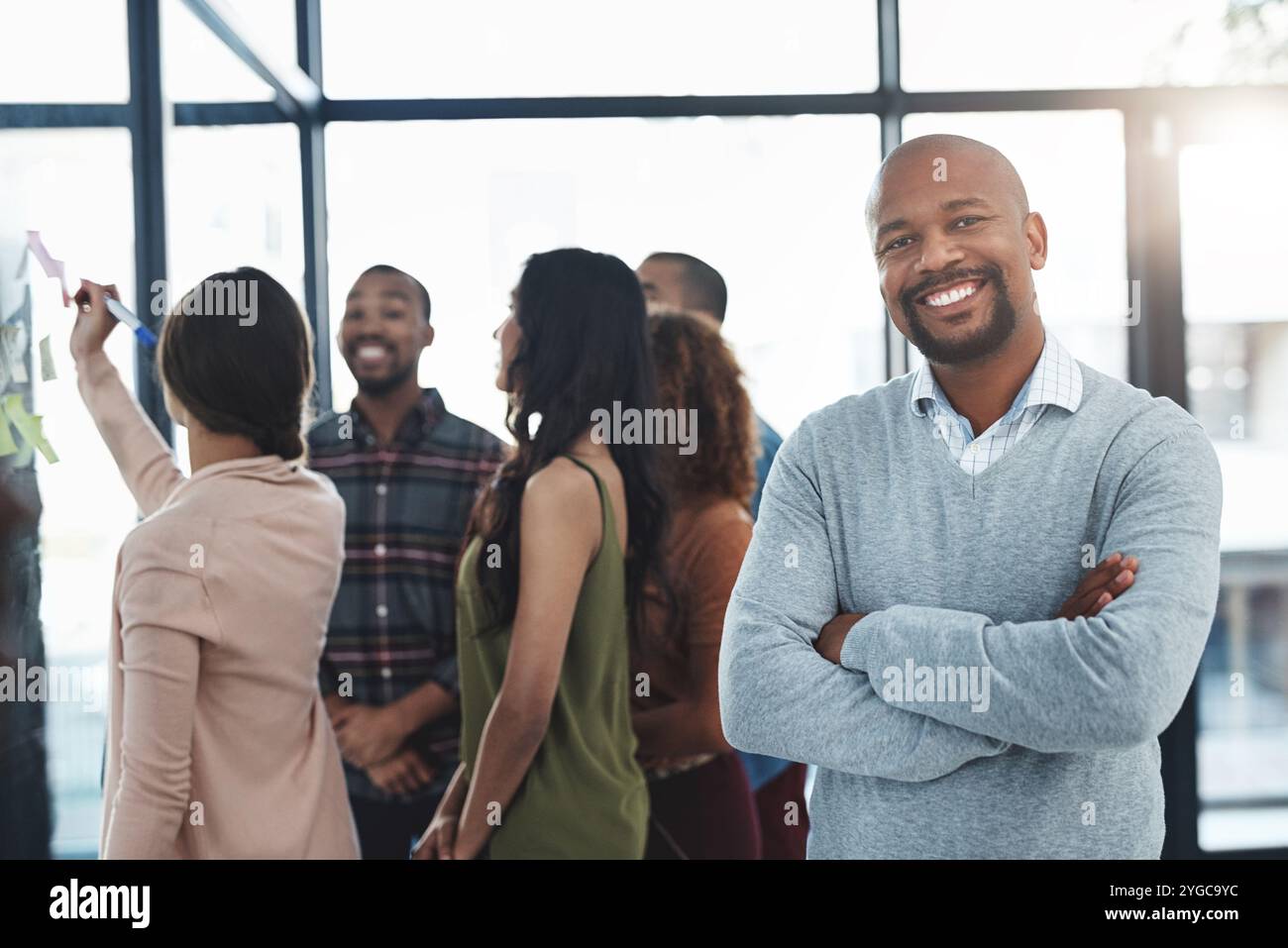 Confident, smile and man with arms crossed, office and ambitious for ...