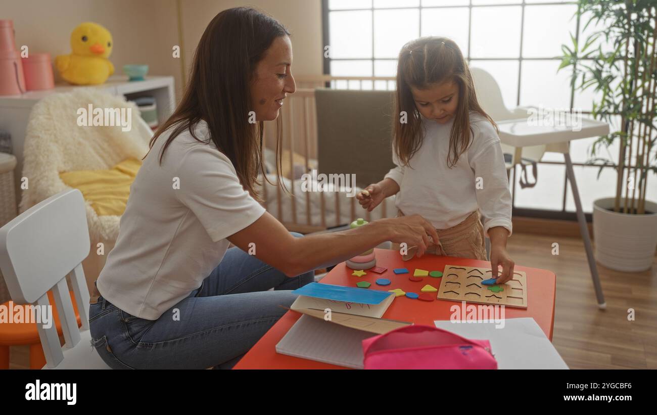 Woman teaching daughter indoors at home showing love and connection in ...
