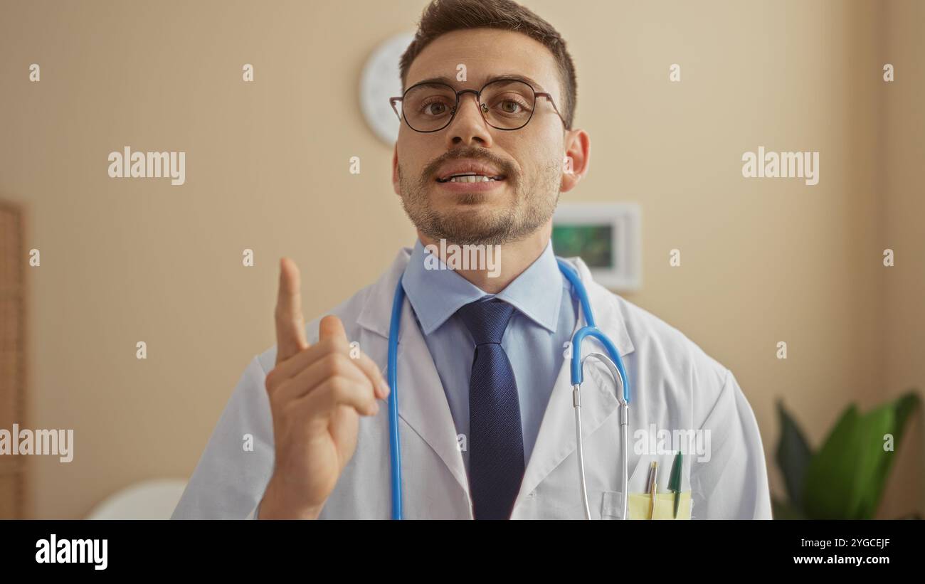 Young hispanic man in white lab coat with stethoscope and beard ...
