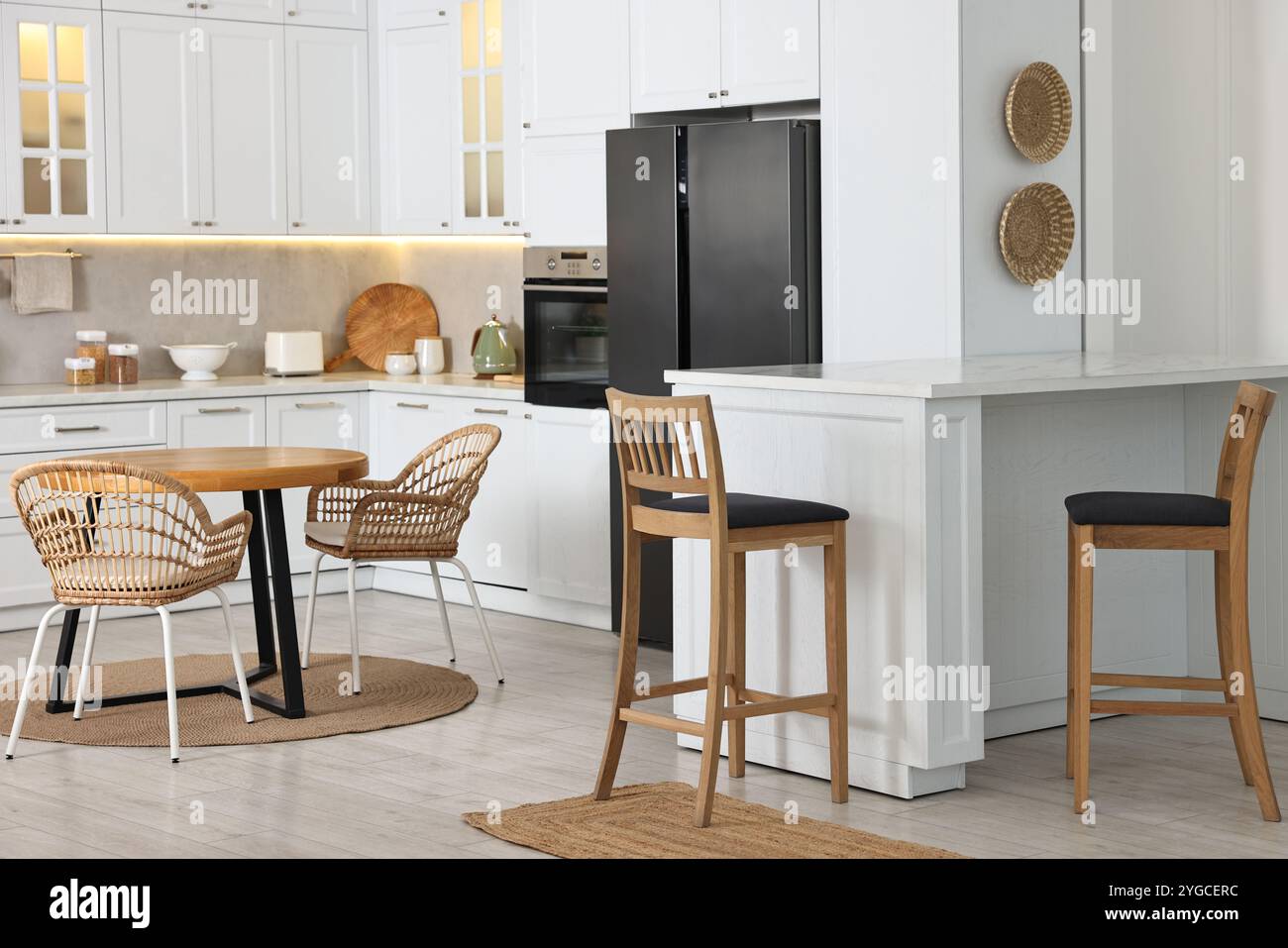 Stylish kitchen with bar stools. Interior design Stock Photo - Alamy