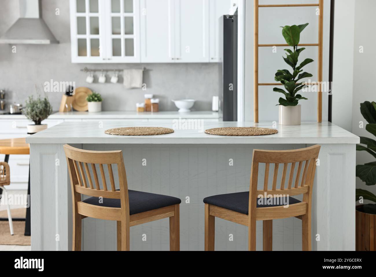 Stylish kitchen with bar stools. Interior design Stock Photo - Alamy