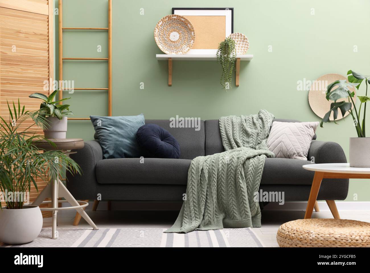 Living room with stool and sofa. Stylish interior design Stock Photo ...