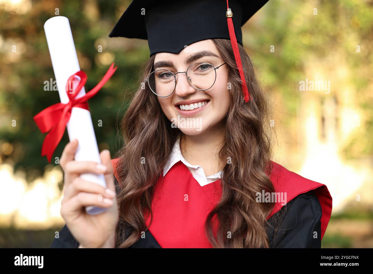 Happy student with diploma after graduation ceremony outdoors Stock ... Happy student with diploma after graduation ceremony outdoors Stock ...