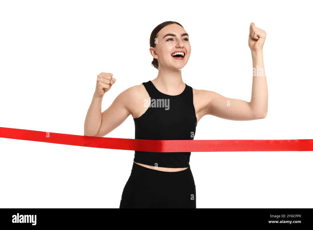 Beautiful woman in sportswear crossing red finish line on white ...