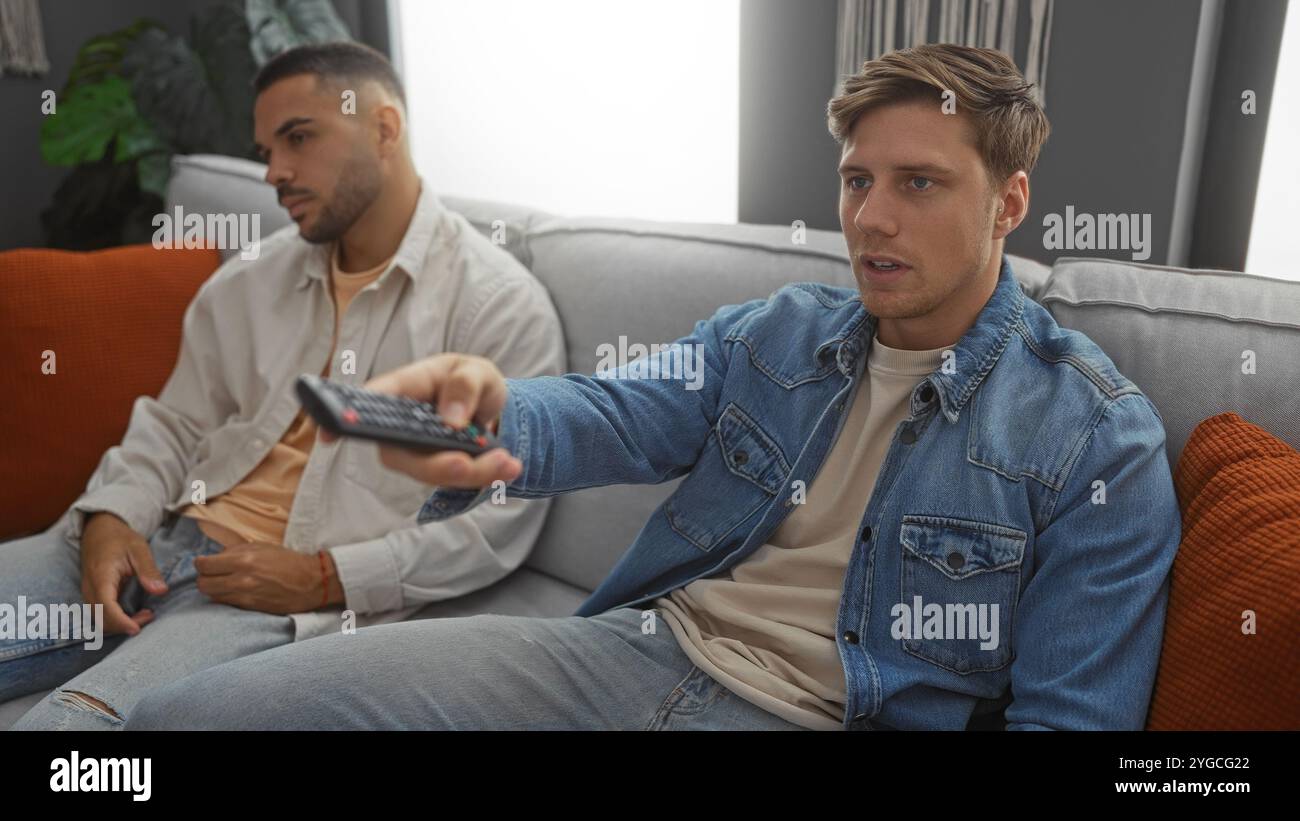 Men watching tv in a cozy living room, showcasing friendship and ...