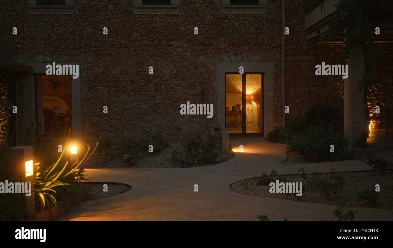 Rustic courtyard night warm interior hi-res stock photography and ...