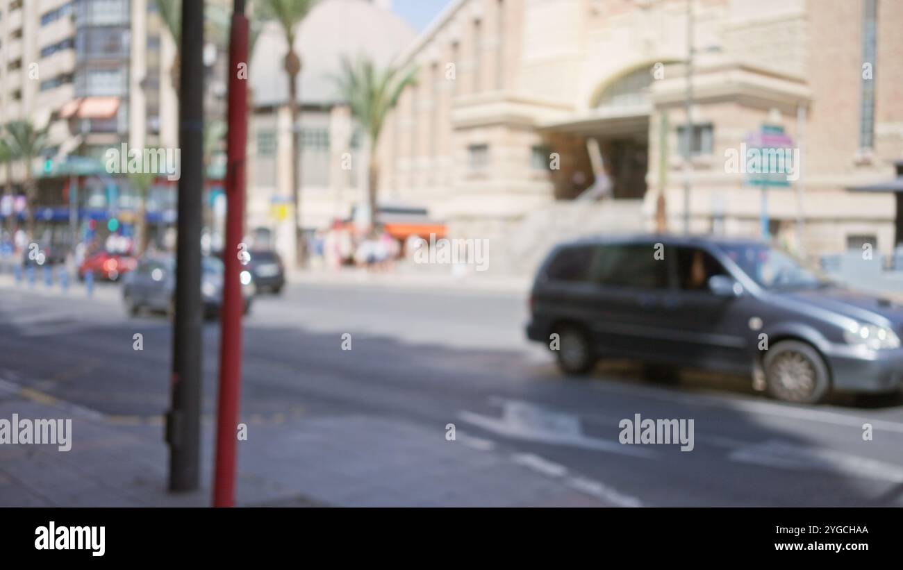 Outdoor city street scene with blurred background, featuring cars ...