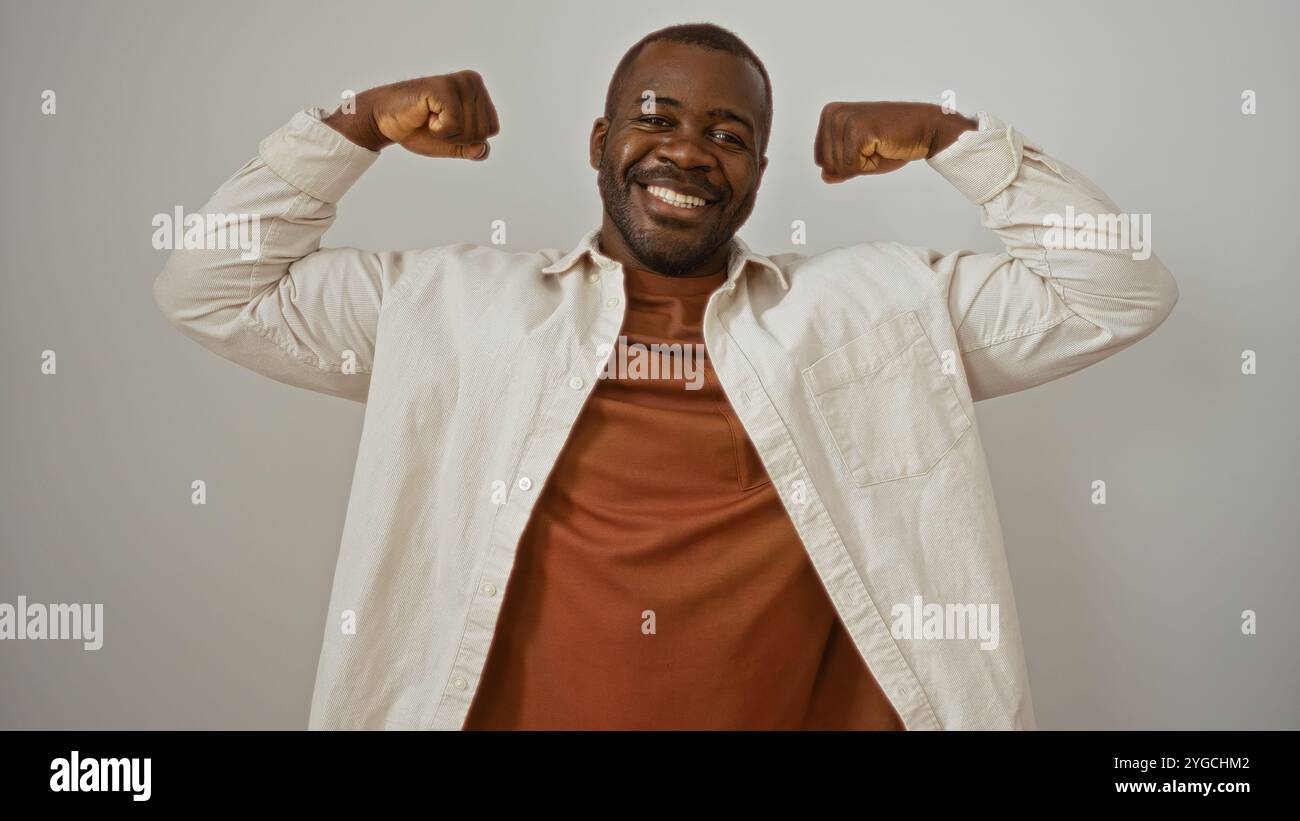 Young african man flexing muscles over isolated white background ...