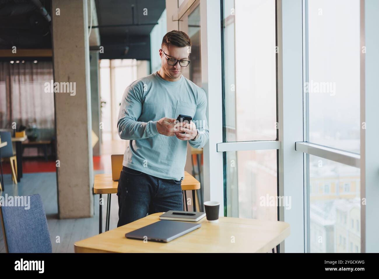 Business man, manager looking out of window in deep thought, standing ...