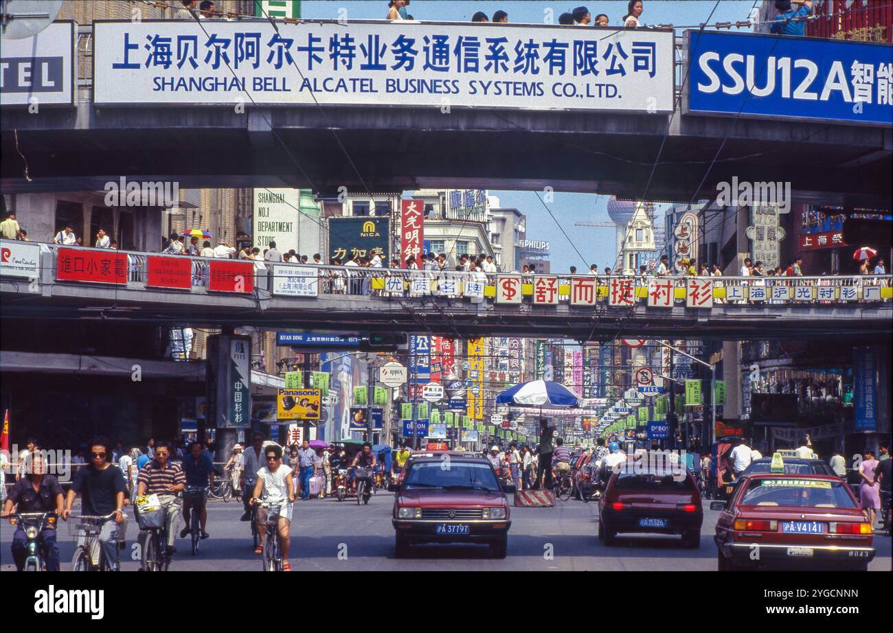 China, Shanghai, busy shopping street with pedestrian fly overs ...
