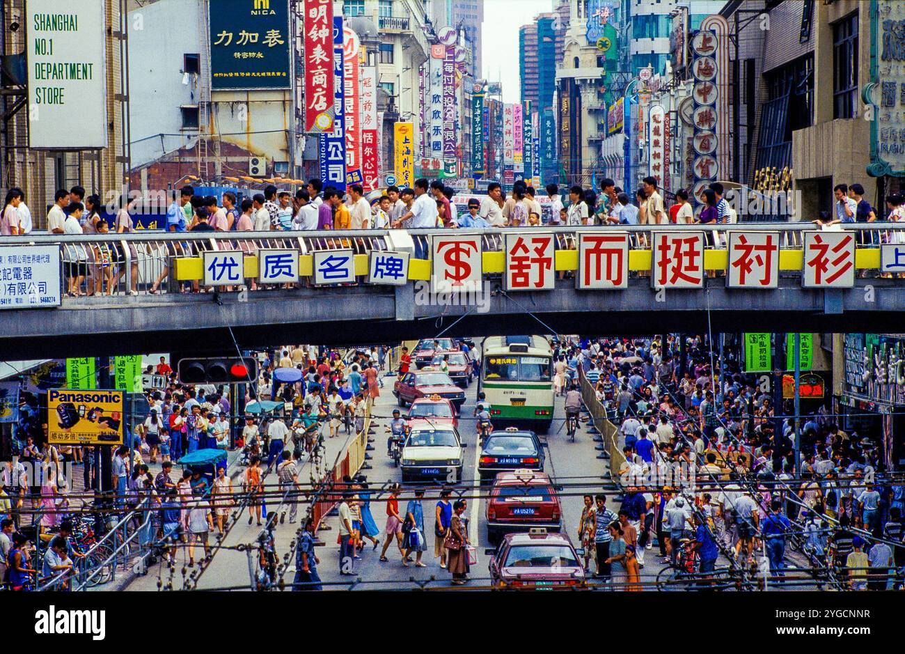 China, Shanghai, busy shopping street with pedestrian fly overs ...