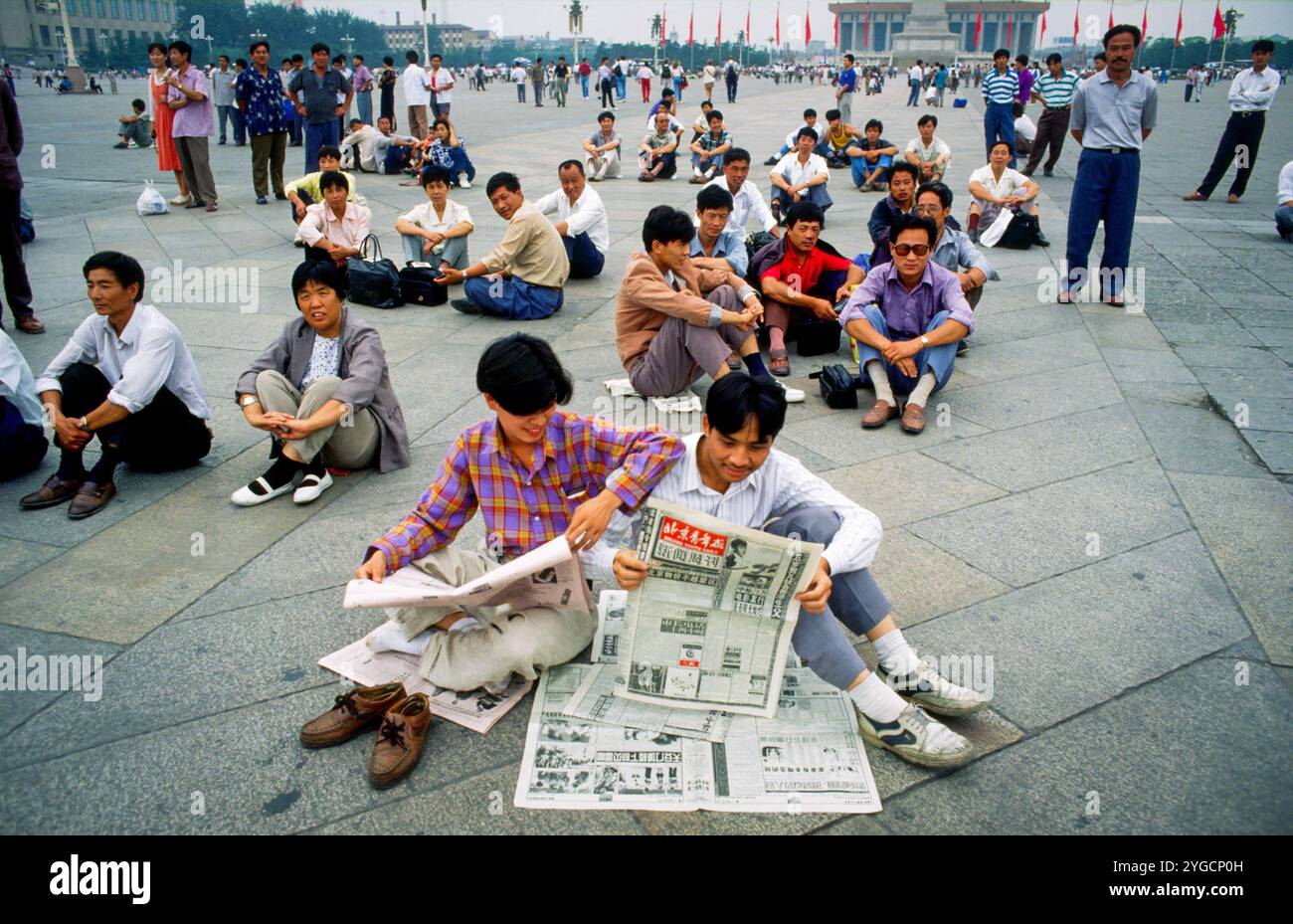 China, Beijing, reading a newspaper on the Tiananmen Square Stock Photo ...