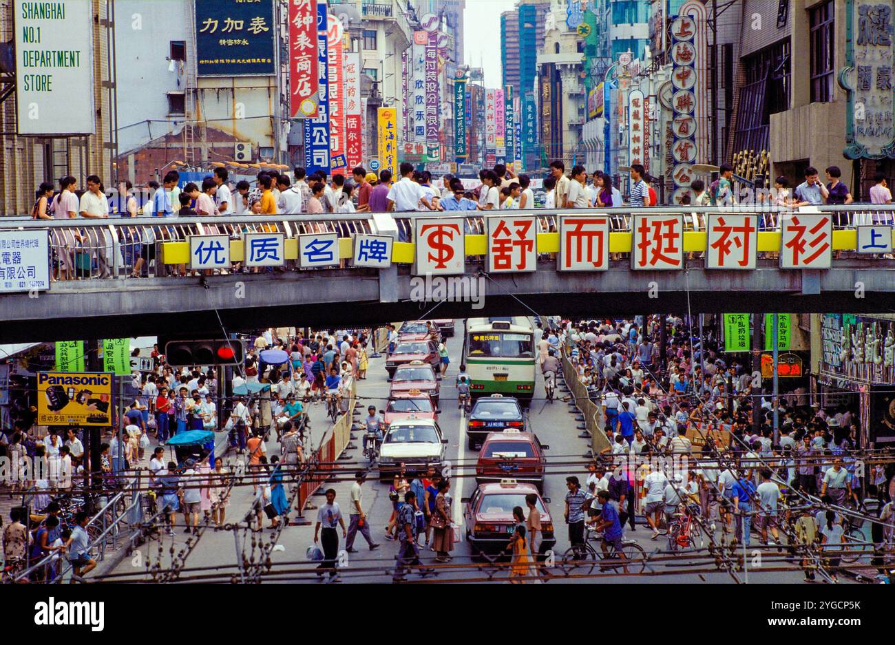 China, Shanghai, busy shopping street with pedestrian fly overs ...