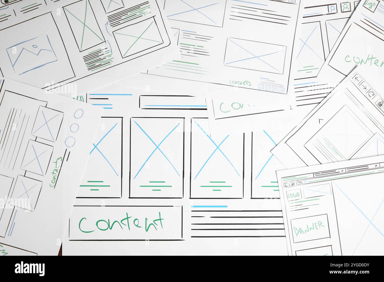 Developing UI design. Sketches of website wireframes on as background ...