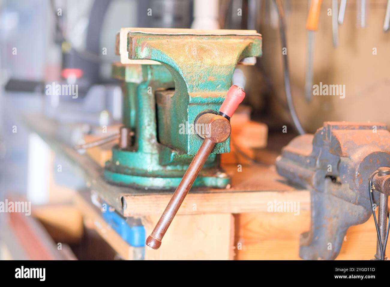 Metal clamping device in repair workshop. Tools of precision, holding ...