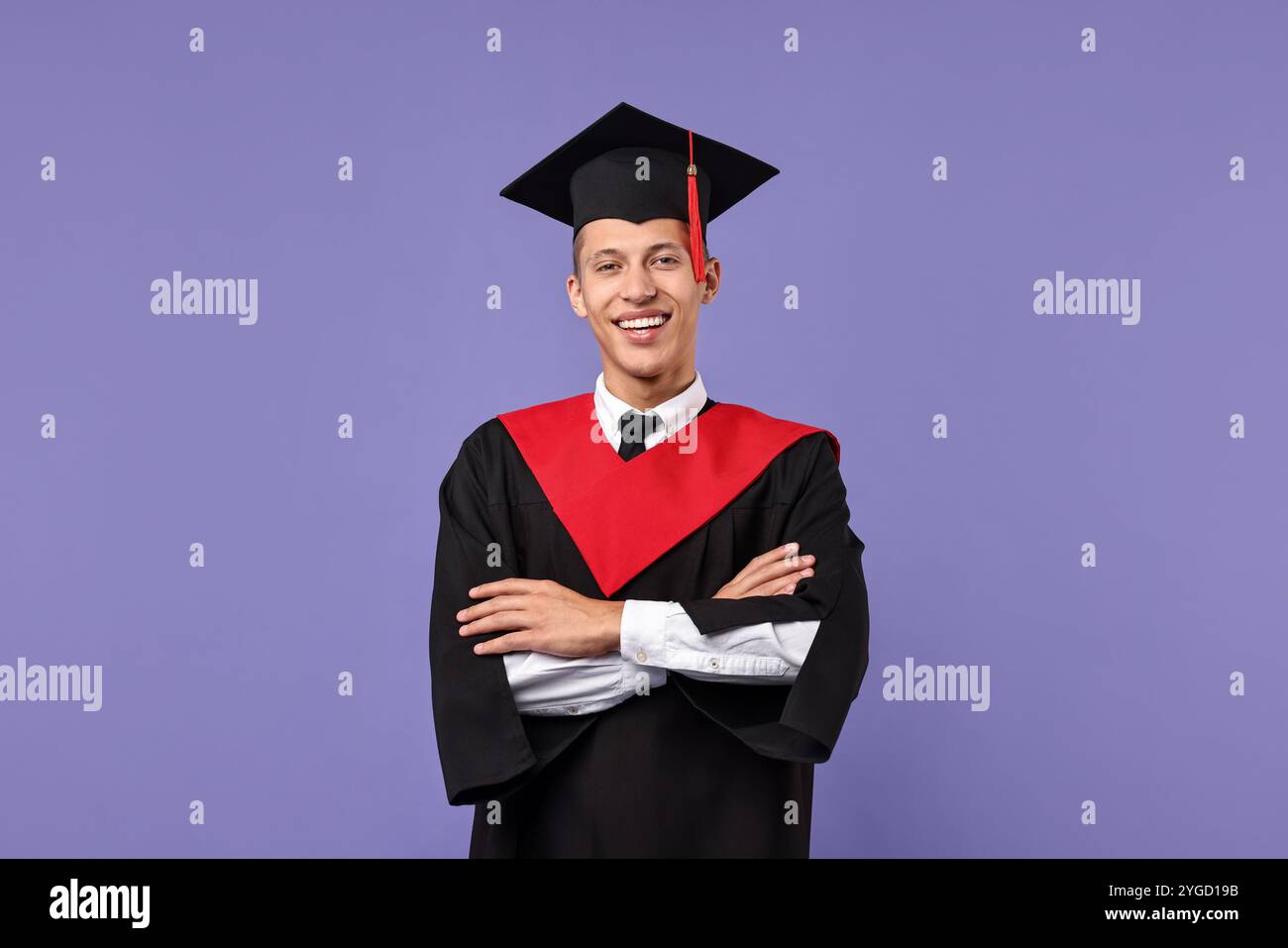 Graduate man confident arms crossed hi-res stock photography and images ...