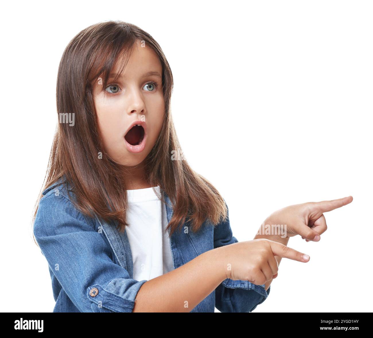 Portrait of scared little girl pointing at something on white ...