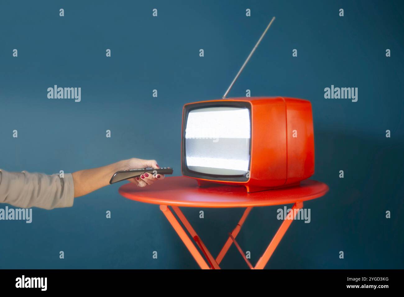 person changes channels on tv with remote control, concept of power ...