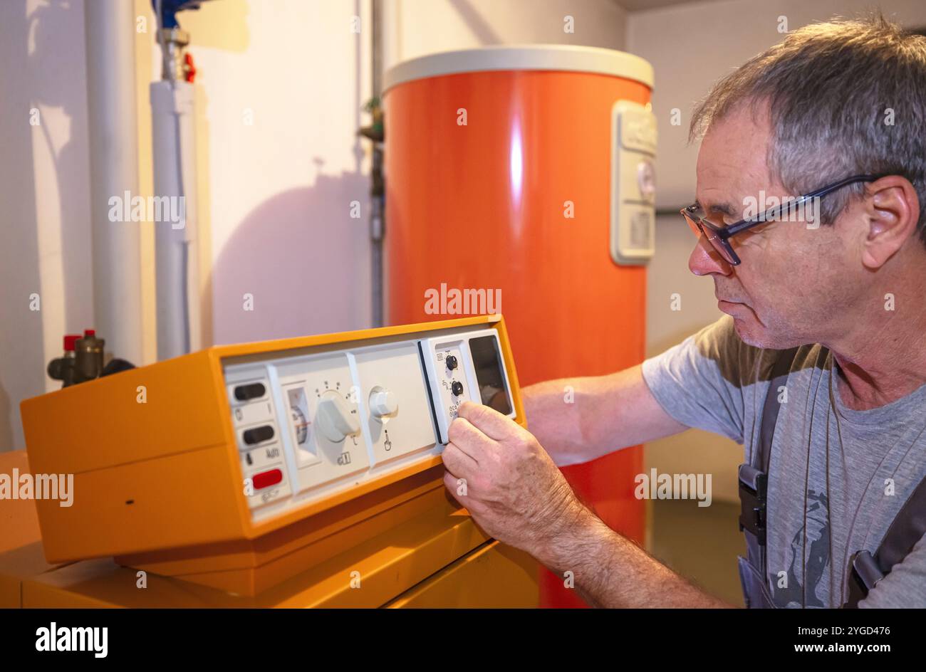 installer checks an old gas heating Stock Photo - Alamy