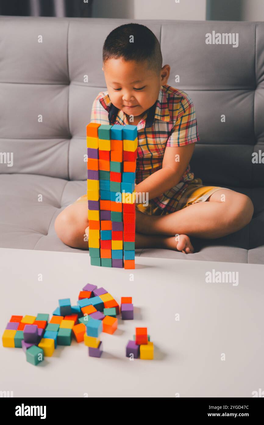 Children enjoy colourful game with educational toy blocks that make ...