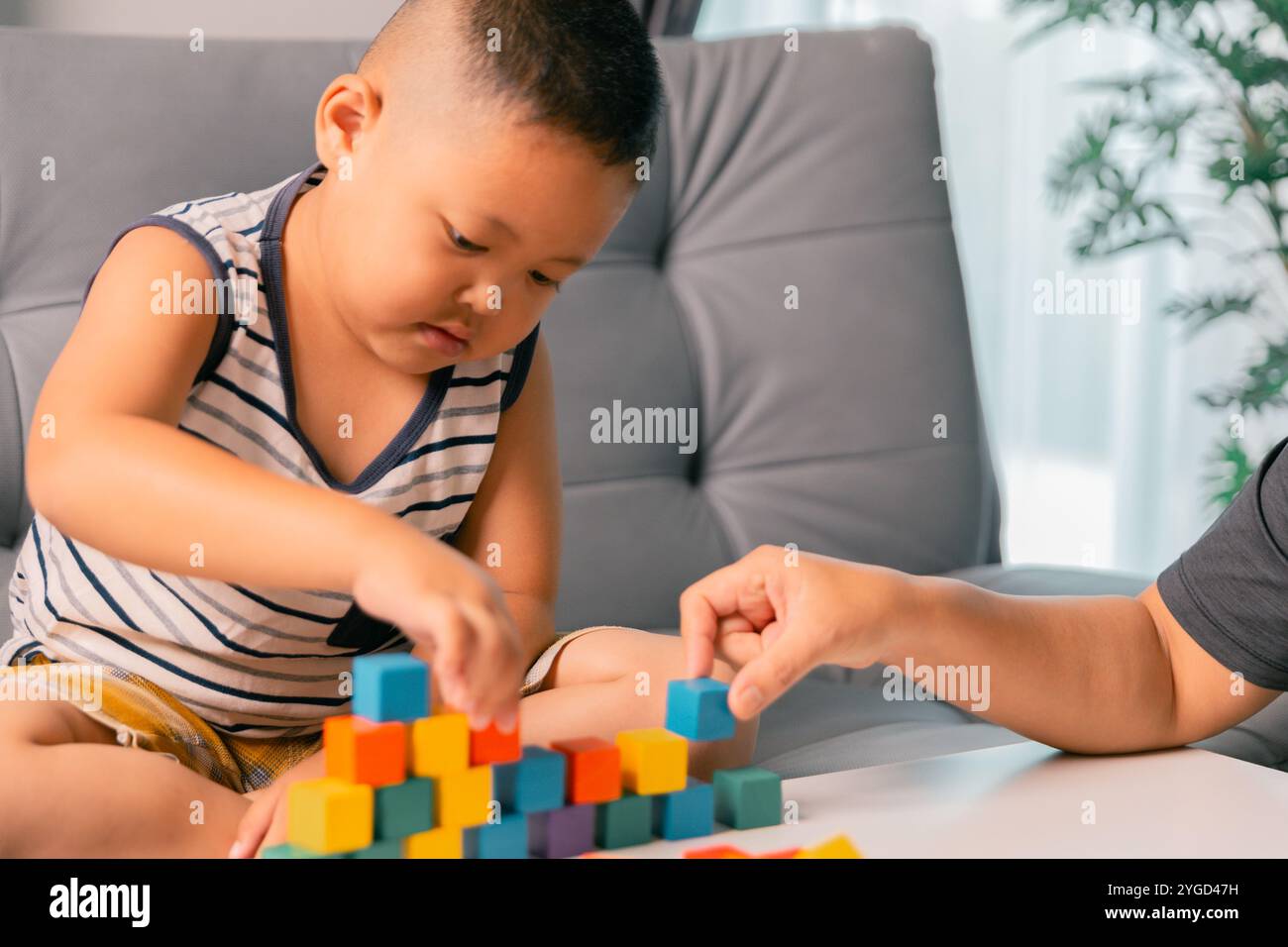 Children enjoy colourful game with educational toy blocks that make ...