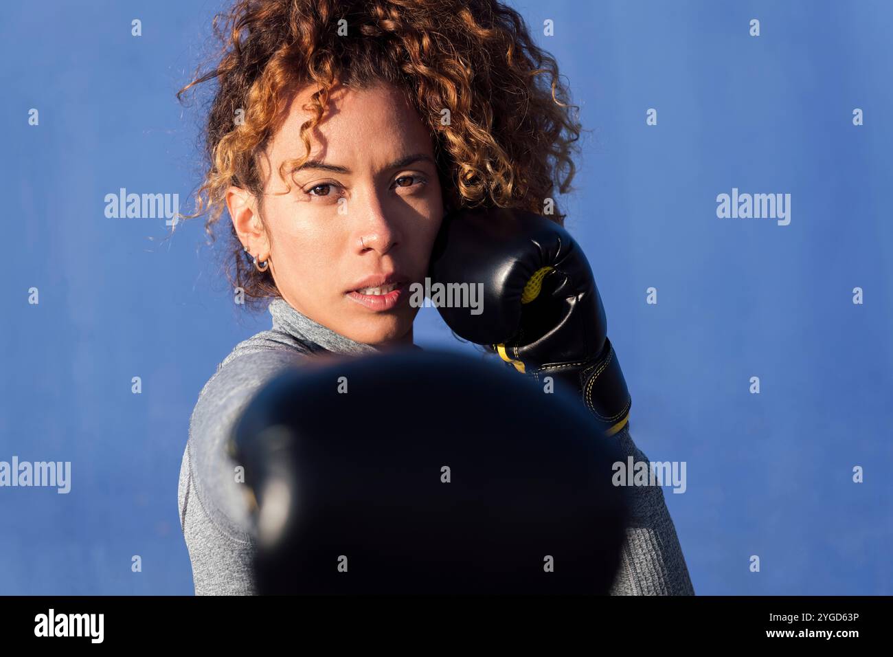 female boxer ready to workout with boxing gloves Stock Photo - Alamy