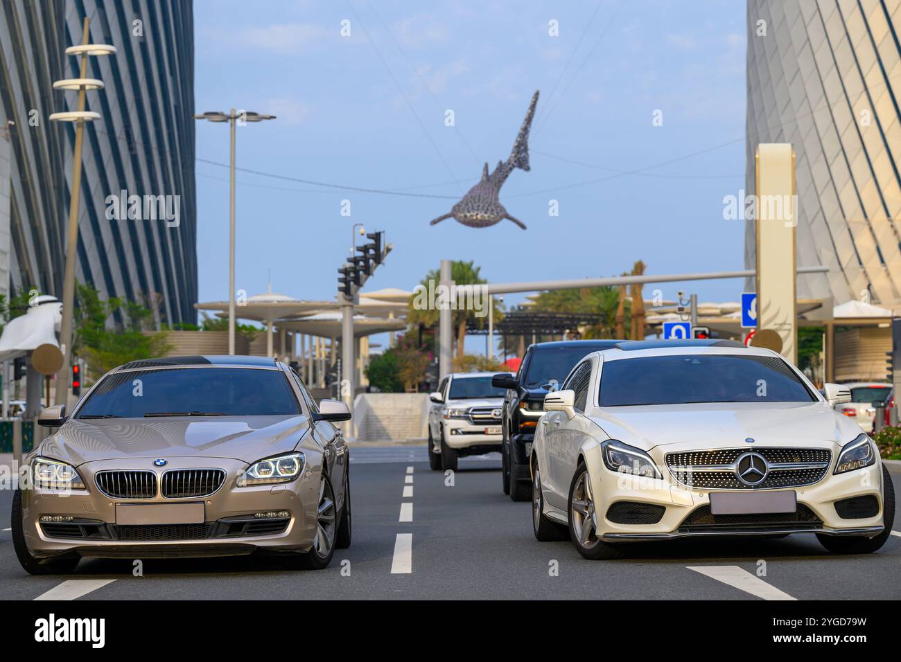 Doha Qatar: April 7, 2024 Two luxury cars participating in the modern ...