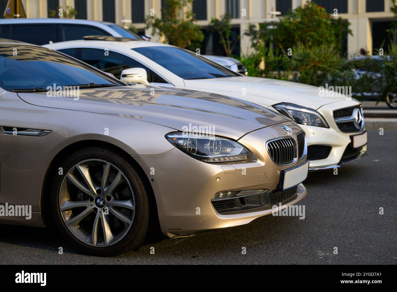 Doha Qatar: April 7, 2024 Two luxury cars participating in the modern ...