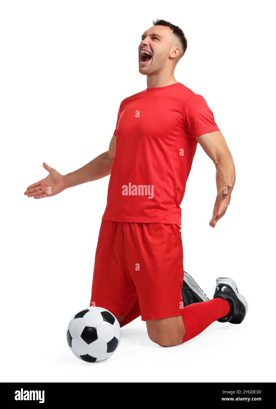 Emotional football player shouting and soccer ball on white background ...