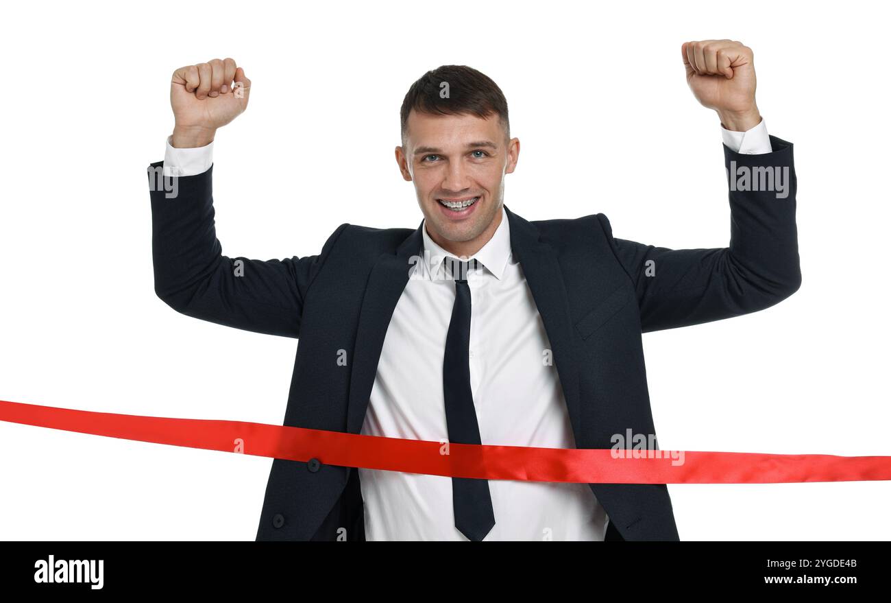Businessman crossing finish line red hi-res stock photography and ...