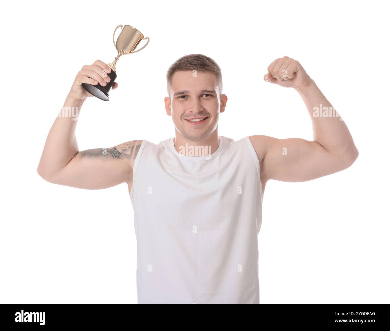 Happy winner with golden trophy cup showing his biceps on white ...