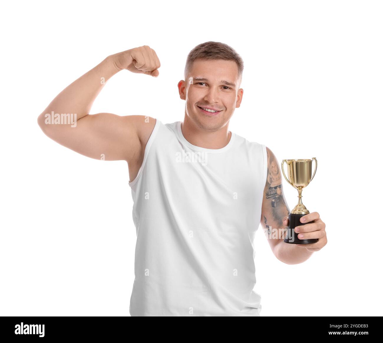 Happy winner with golden trophy cup showing his bicep on white ...