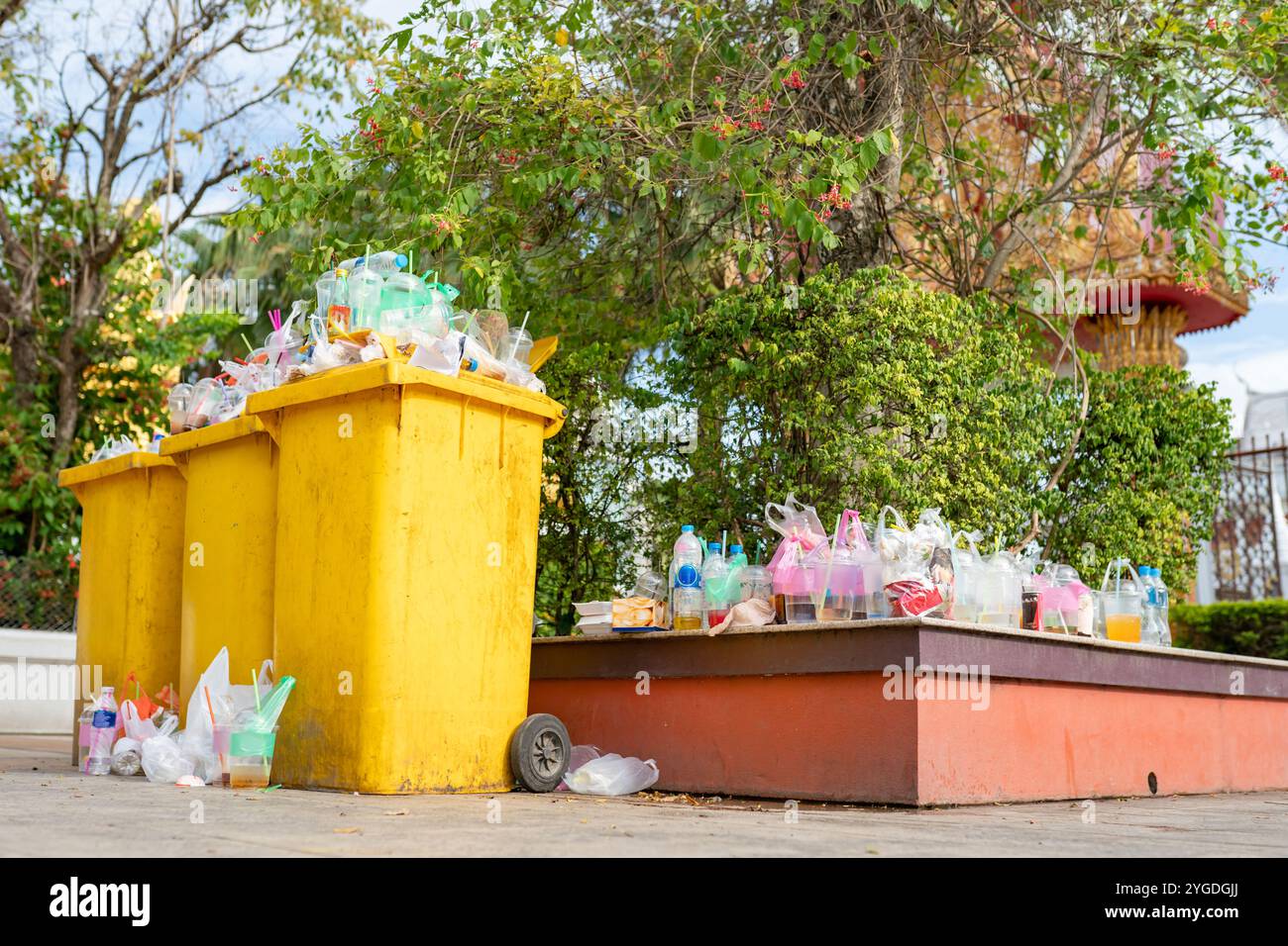 Garbage bins are overflowing since there are not enough receptacles and ...