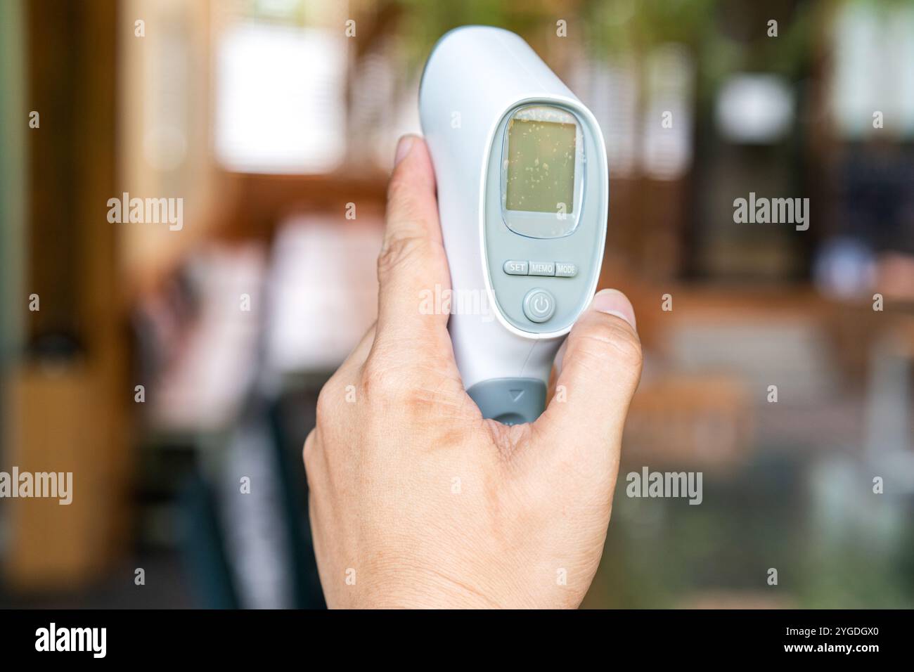 Thermometer Gun in Man's Hand. It's Digital Infrared Sight Temperature ...