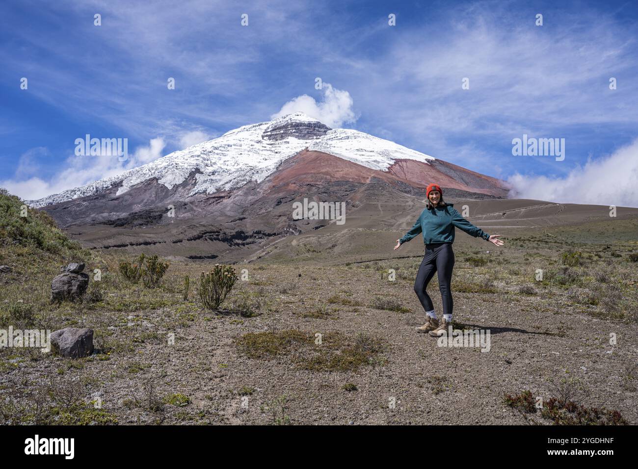 Women poses in front of the Cotopaxi volcano, Cotopaxi, Cotopaxi ...