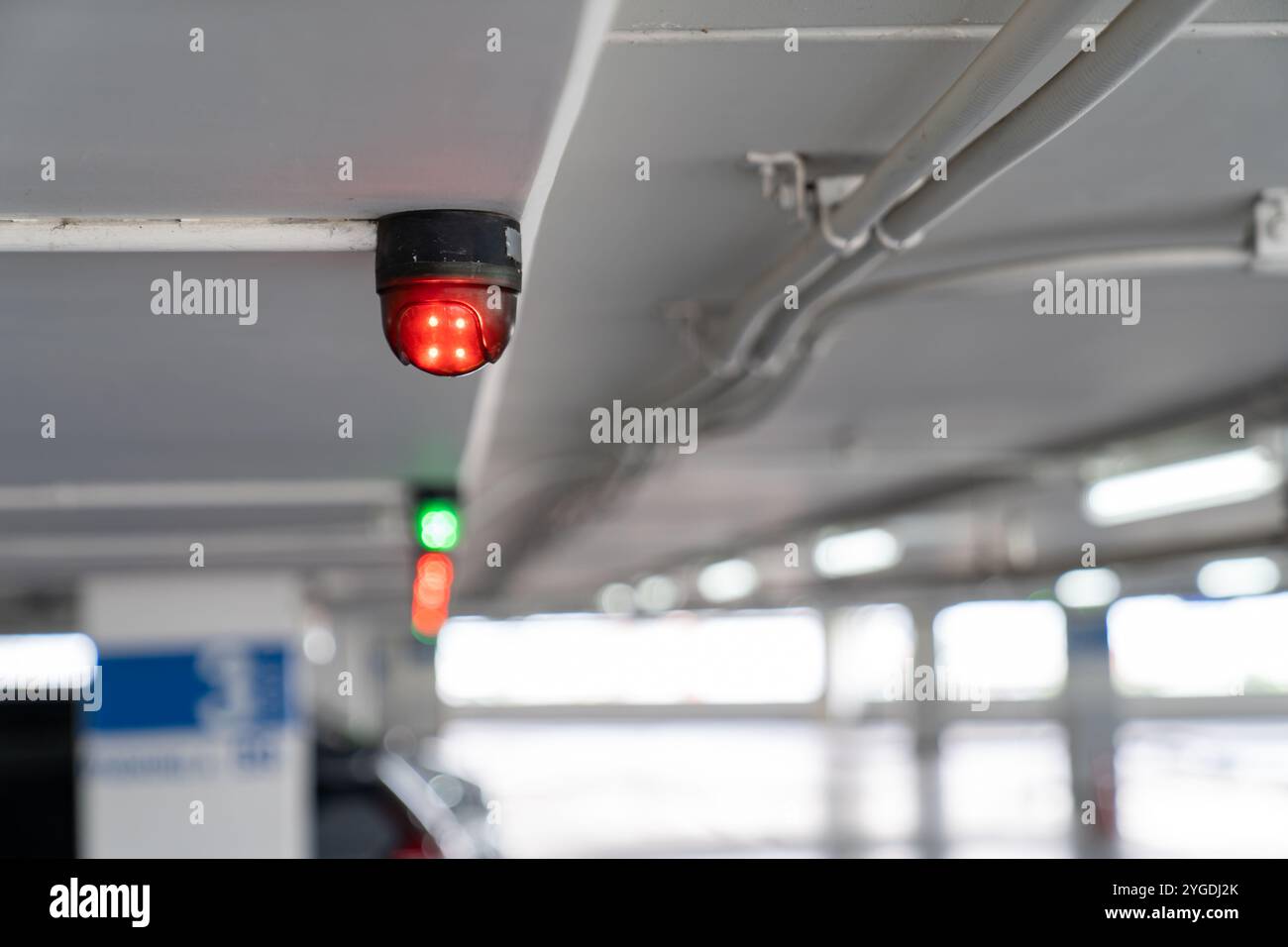Close up to overhead LED status light of car parking in department ...