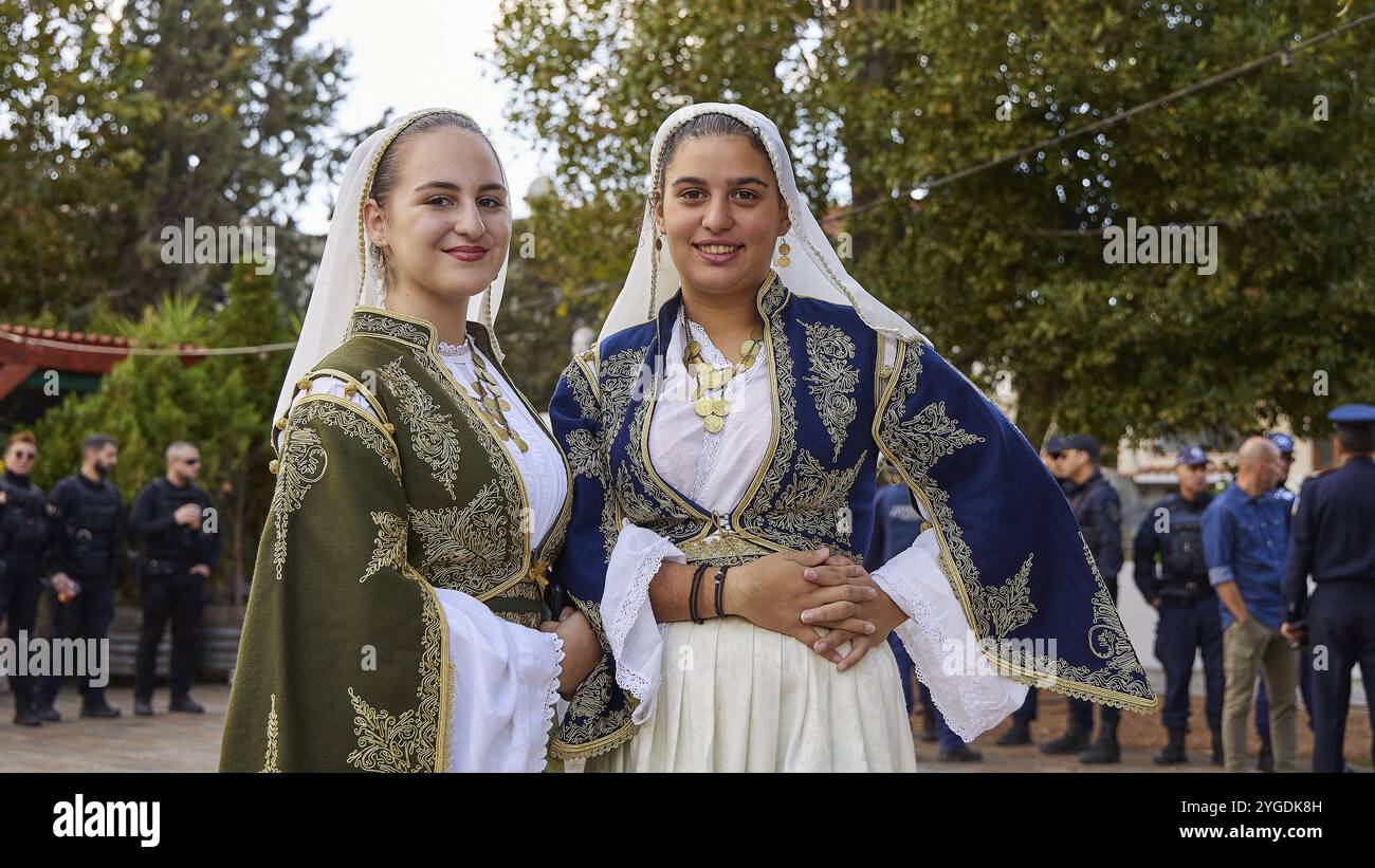 Two woman in traditional Cretan traditional costume with gold ornaments ...