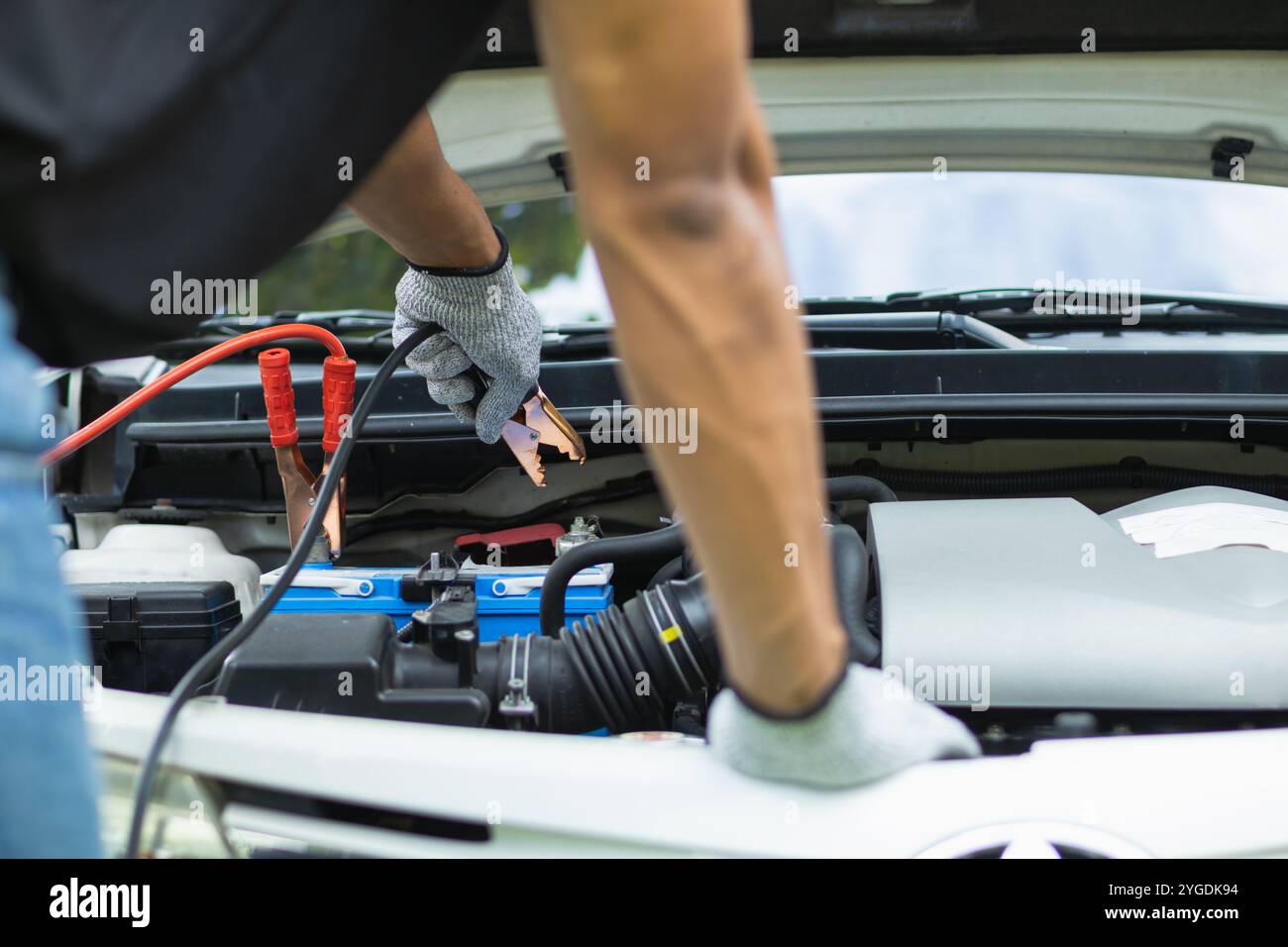 Mechanic fixing jump start hi-res stock photography and images - Alamy
