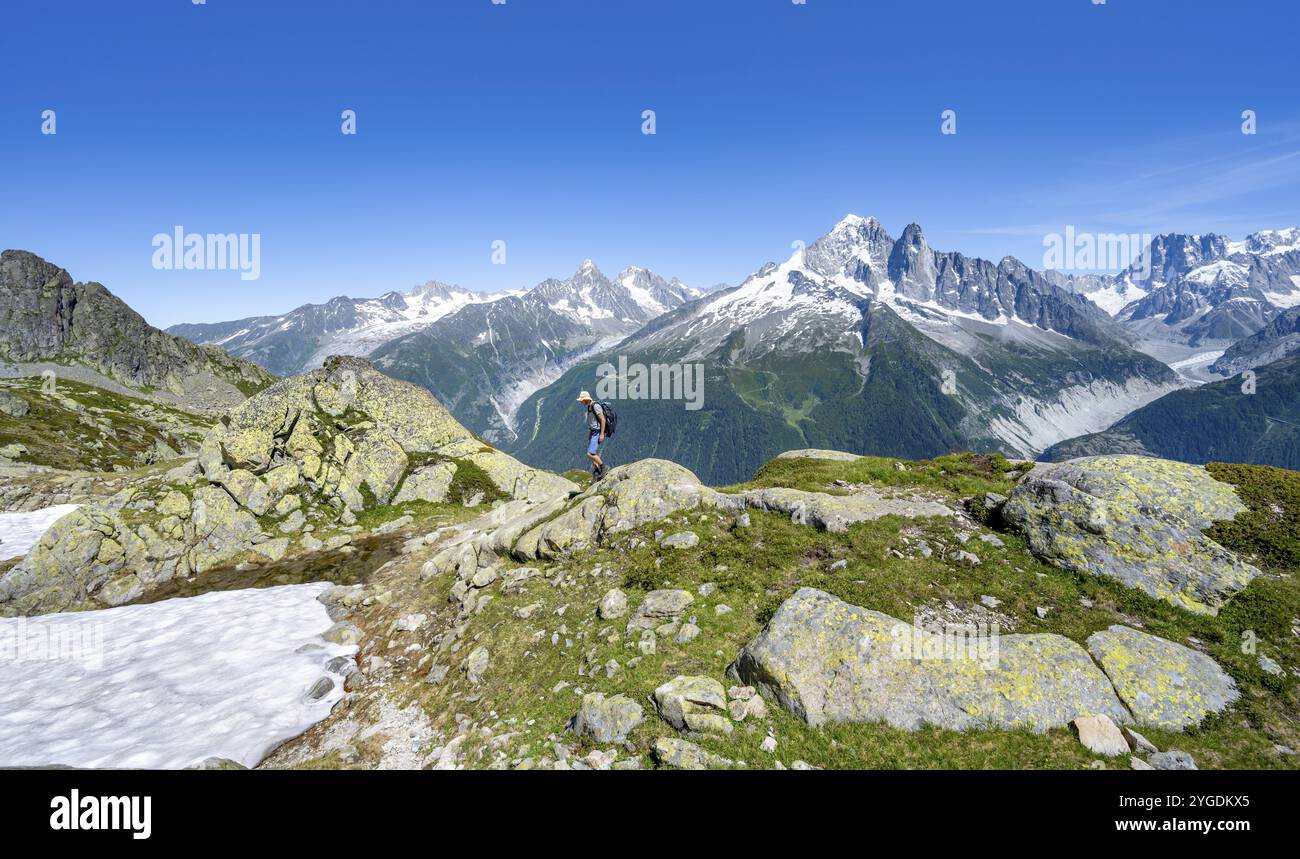 Mountaineer on a hiking trail in front of a mountain landscape, view of ...