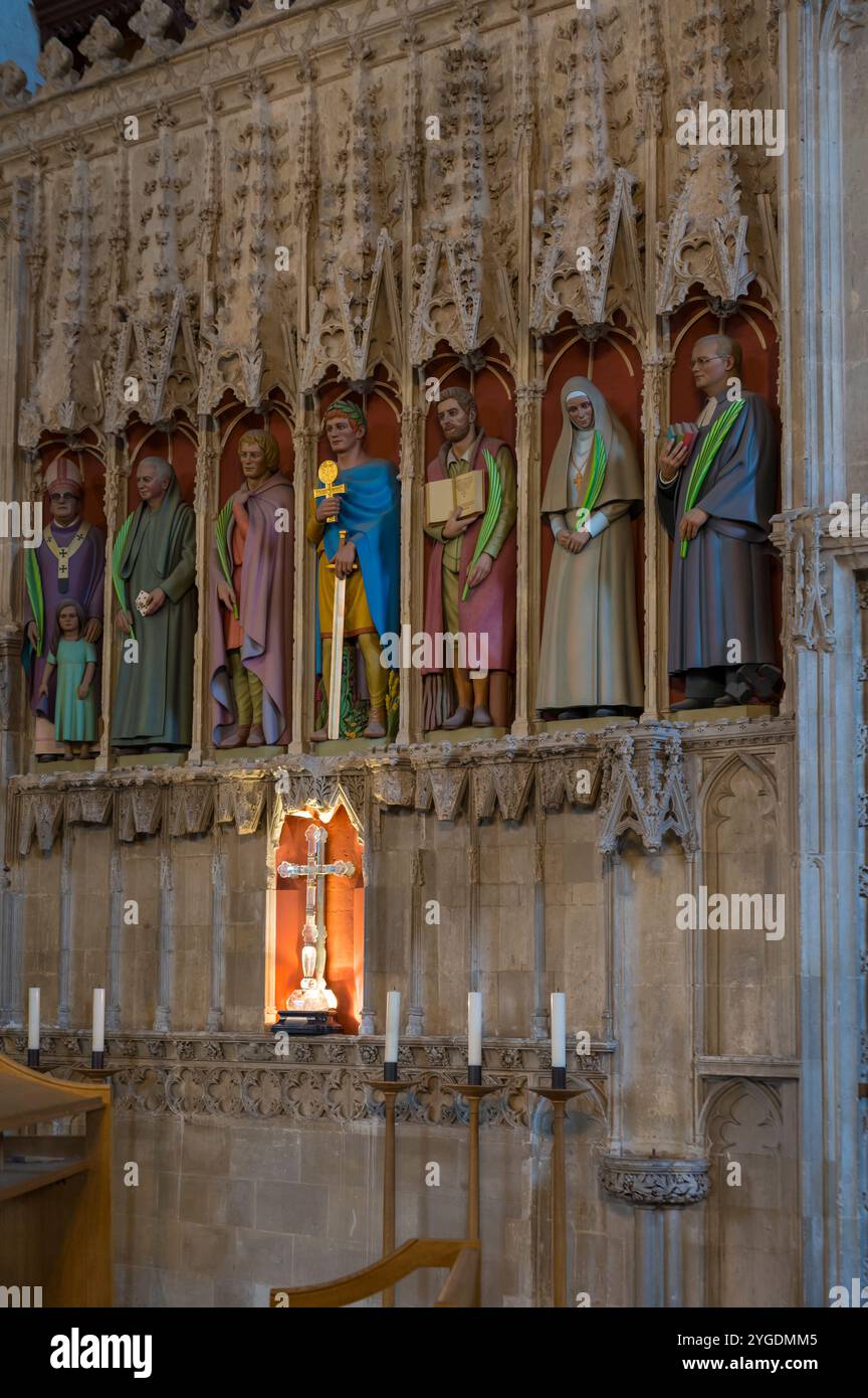 Medieval nave screen with sculptures depicting the martyrs stand at the ...