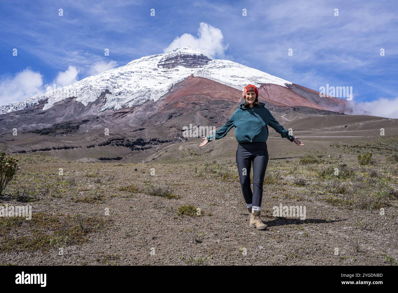 Women poses in front of the Cotopaxi volcano, Cotopaxi, Cotopaxi ...