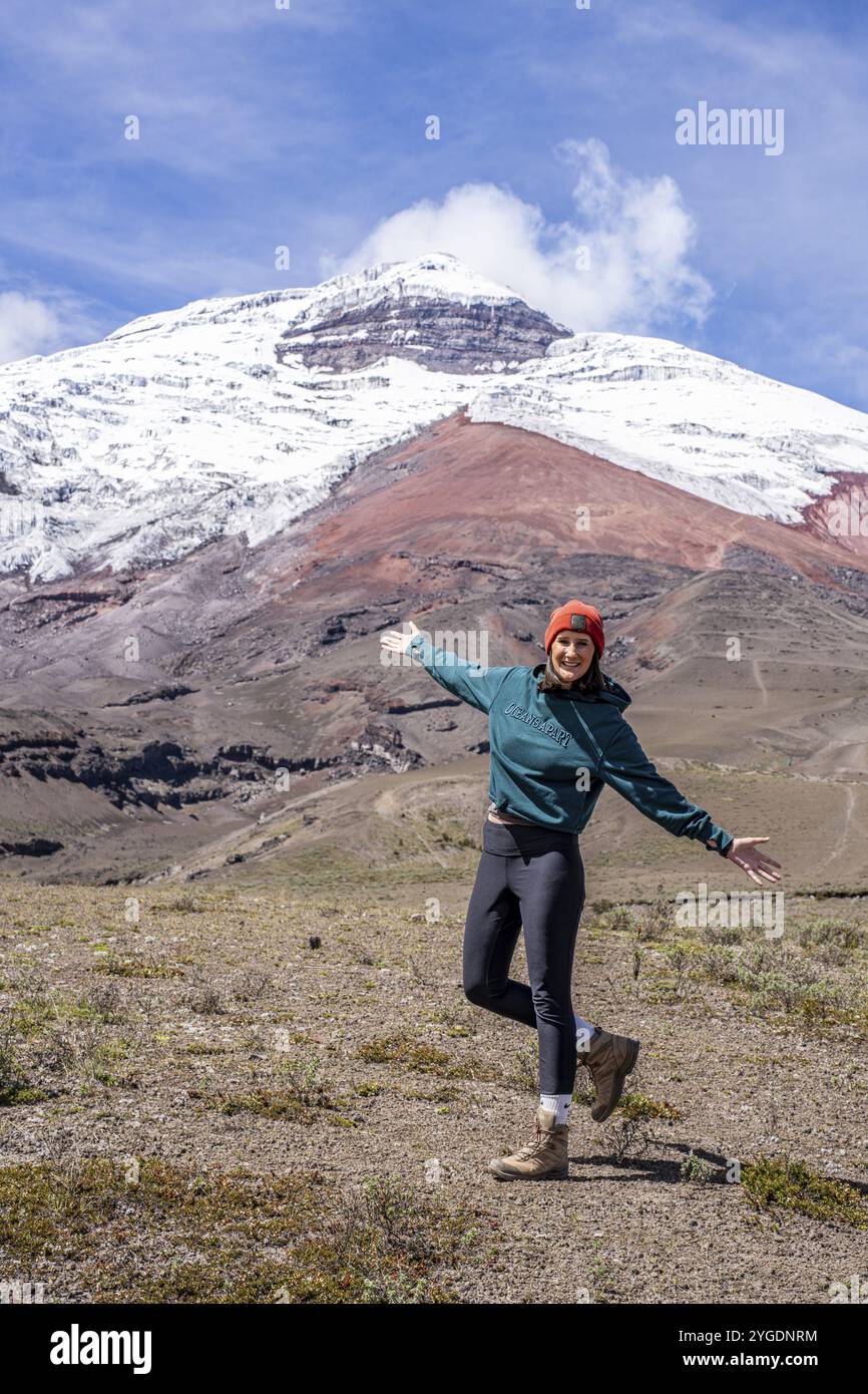 Women poses in front of the Cotopaxi volcano, Cotopaxi, Cotopaxi ...