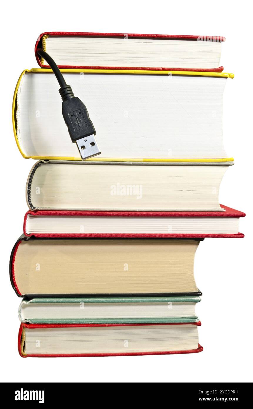 Pile of books with USB cable sticking out Stock Photo - Alamy