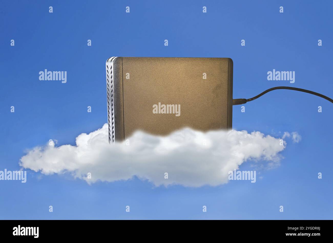 Hard disk on a cloud in the blue sky as a symbol for cloud storage Stock Photo - Alamy
