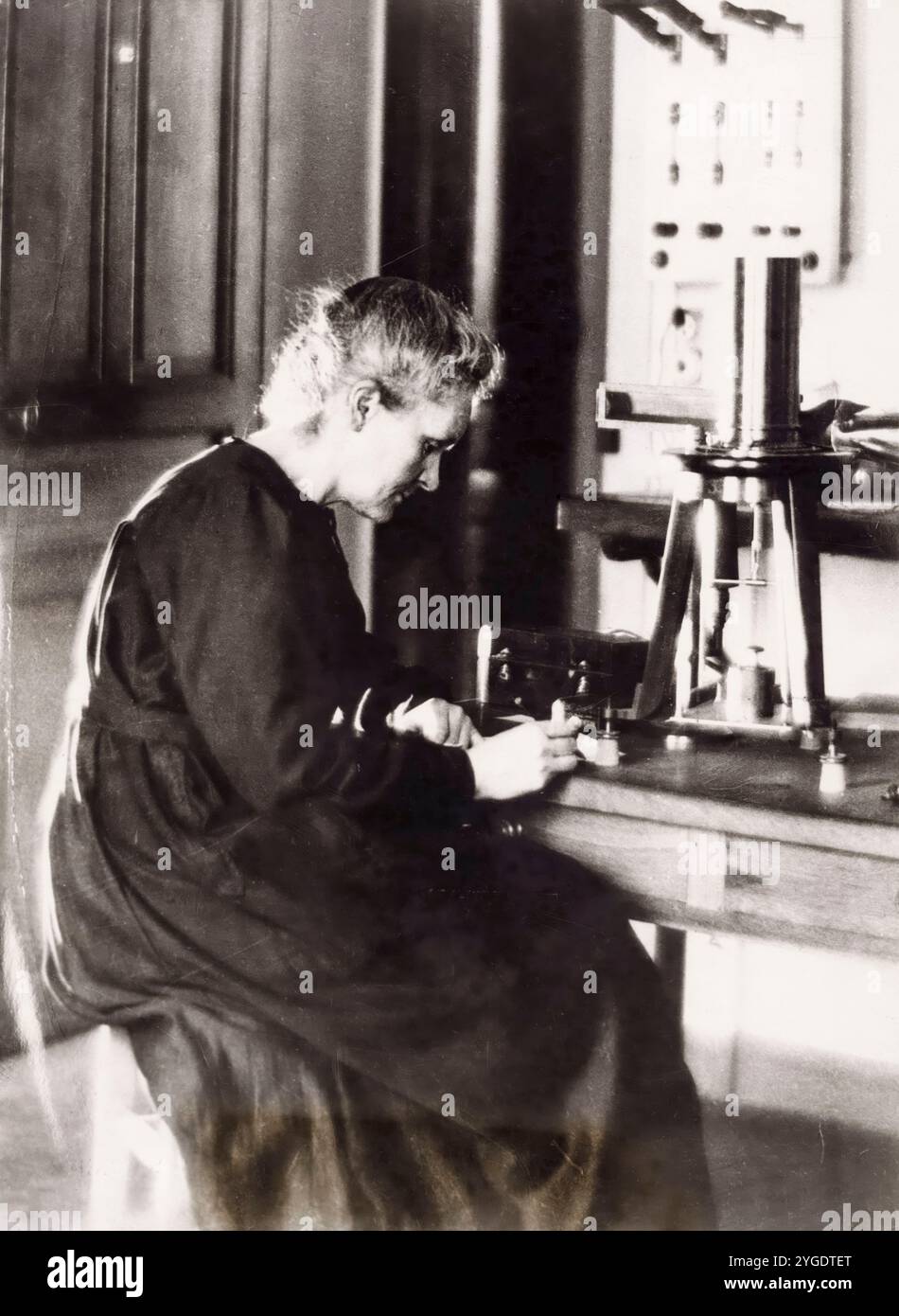 Marie Curie (1867-1934) working in a laboratory, portrait photograph by ...