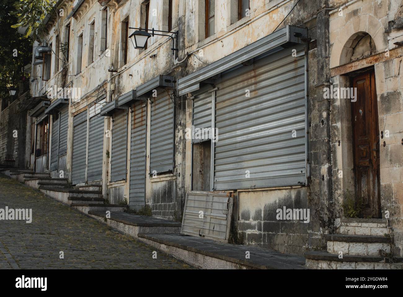 Closed storefronts on the streets of Gjirokaster in Albania Stock Photo ...