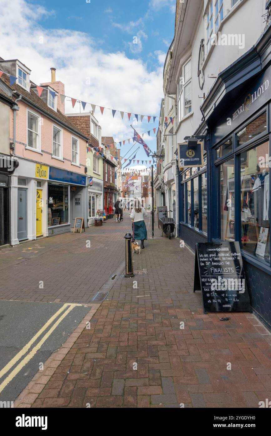 Shops And Business, A Woman Walks Her Dog On High Street, Cowes Isle Of ...