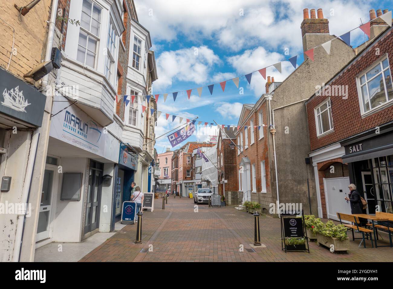 Shops And Business, A Woman Walks Her Dog On High Street, Cowes Isle Of ...